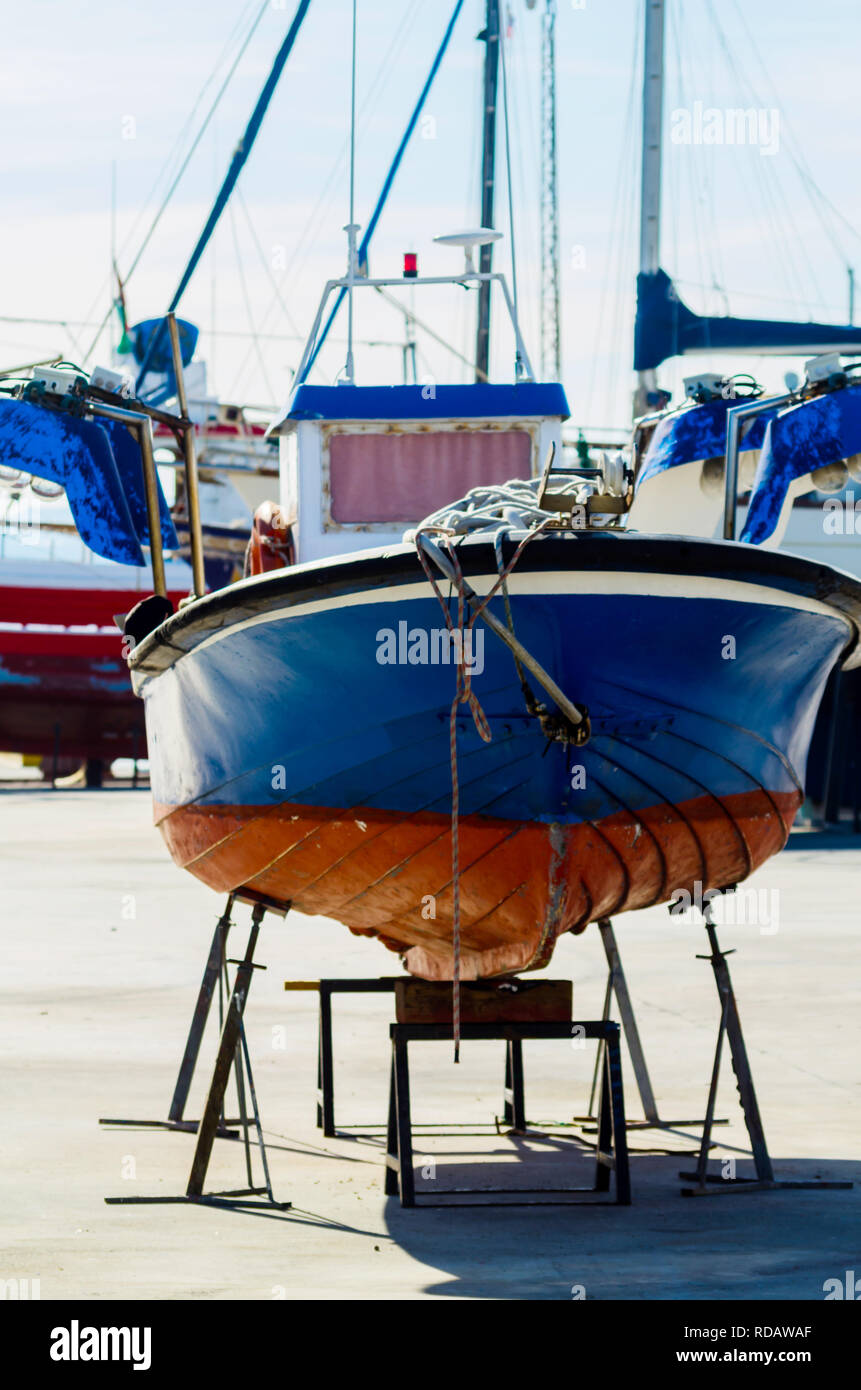Boat on stand on the shore, close up on the part of the yacht, luxury ...