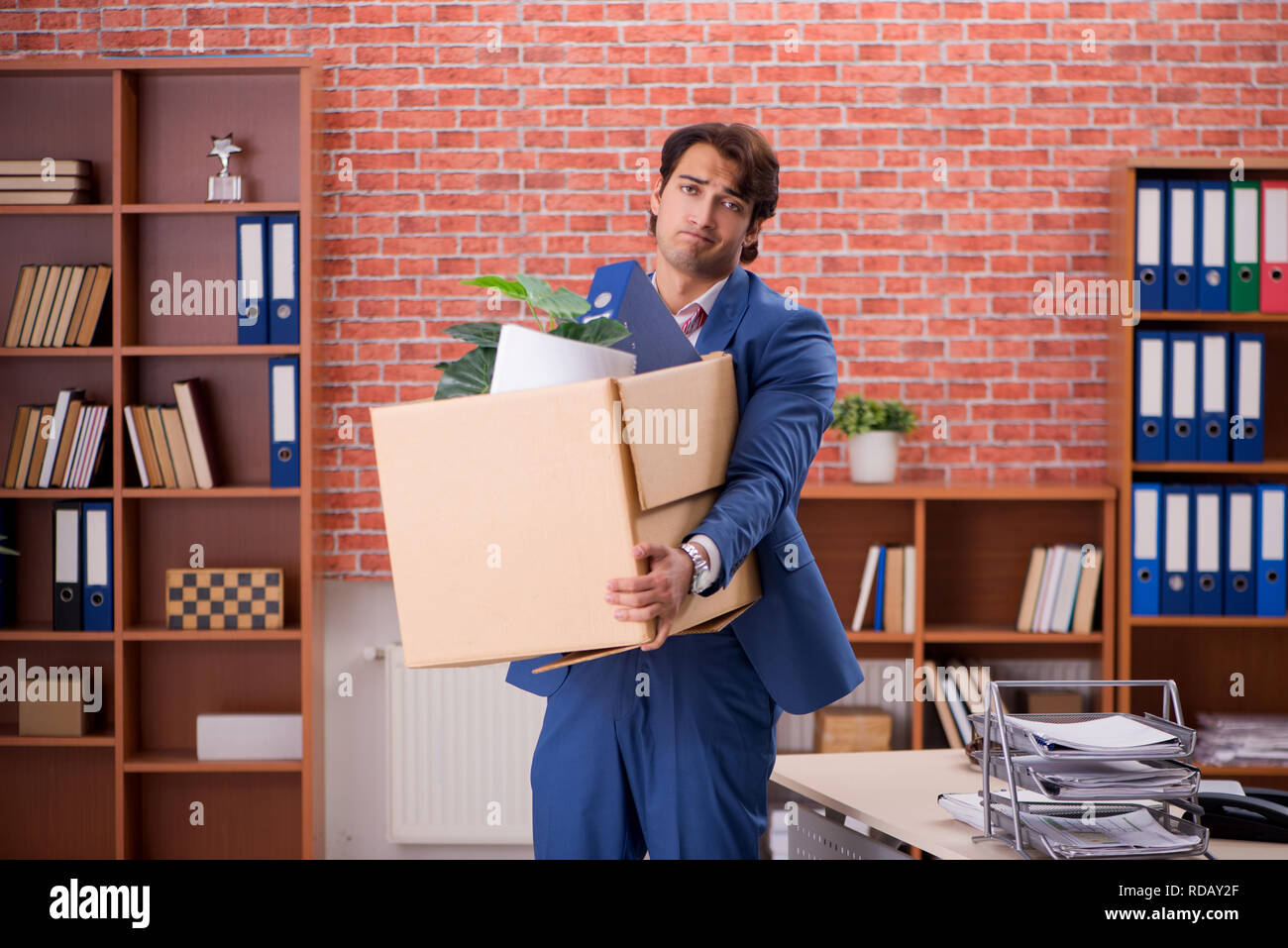 Young person being fired from his work Stock Photo - Alamy