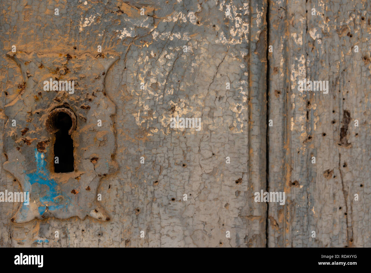 keyhole in an old door with an interesting texture, a remnant of an old ...