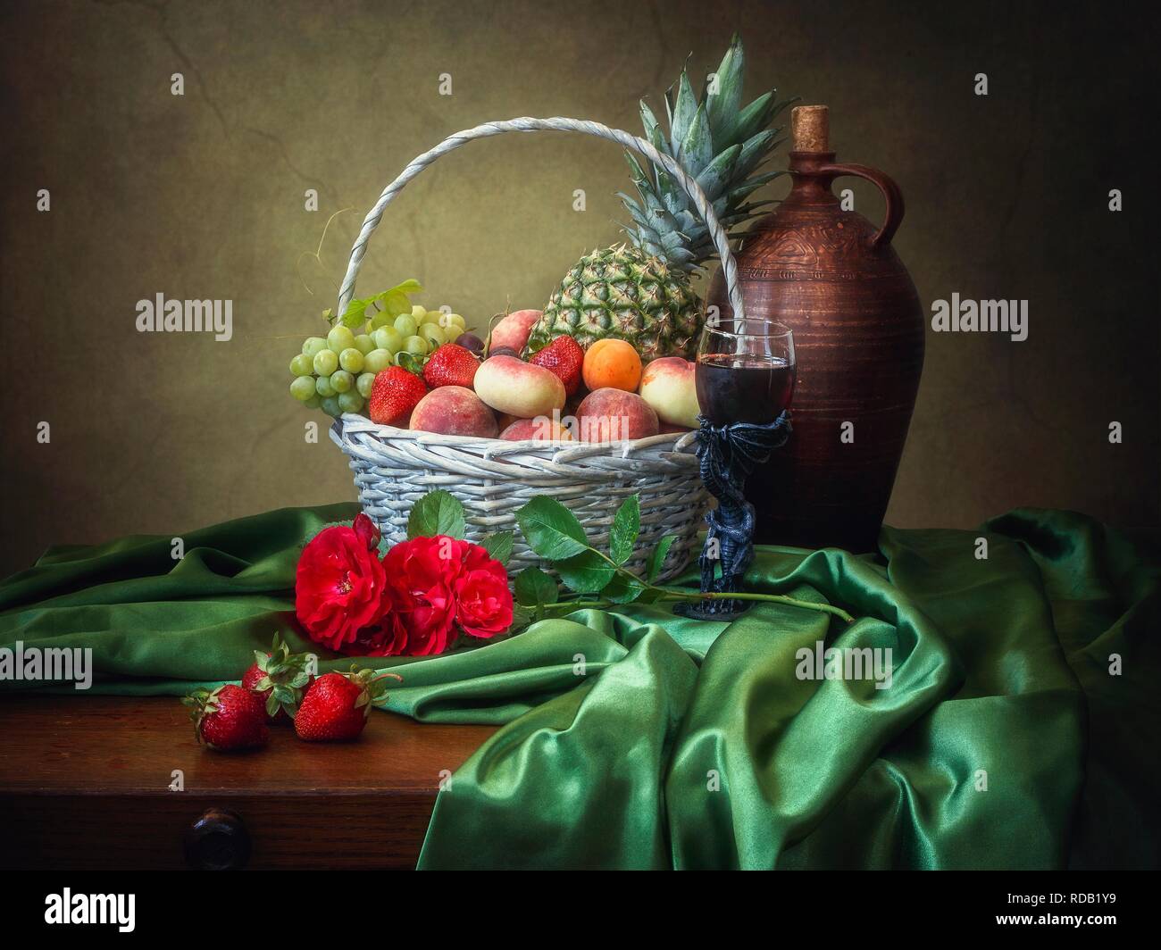 Still life with basket of fruits Stock Photo - Alamy