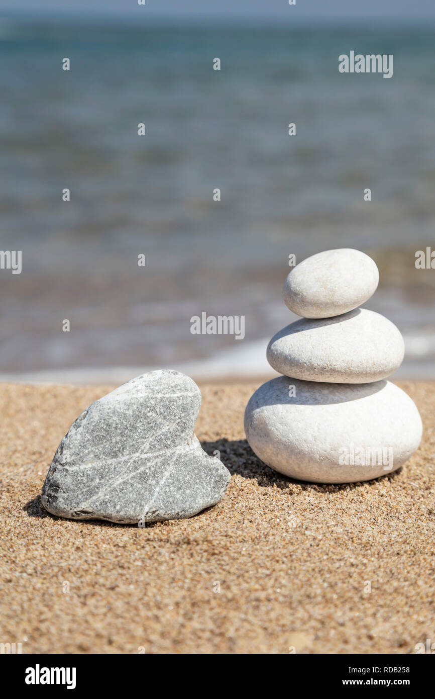 Sandy beach with pebble heart hi-res stock photography and images - Alamy