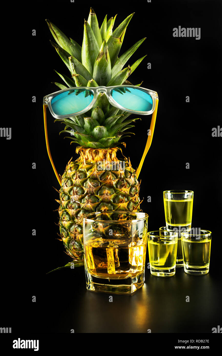 Scottish whisky in a glass with pineapple, golden color whiskey ...