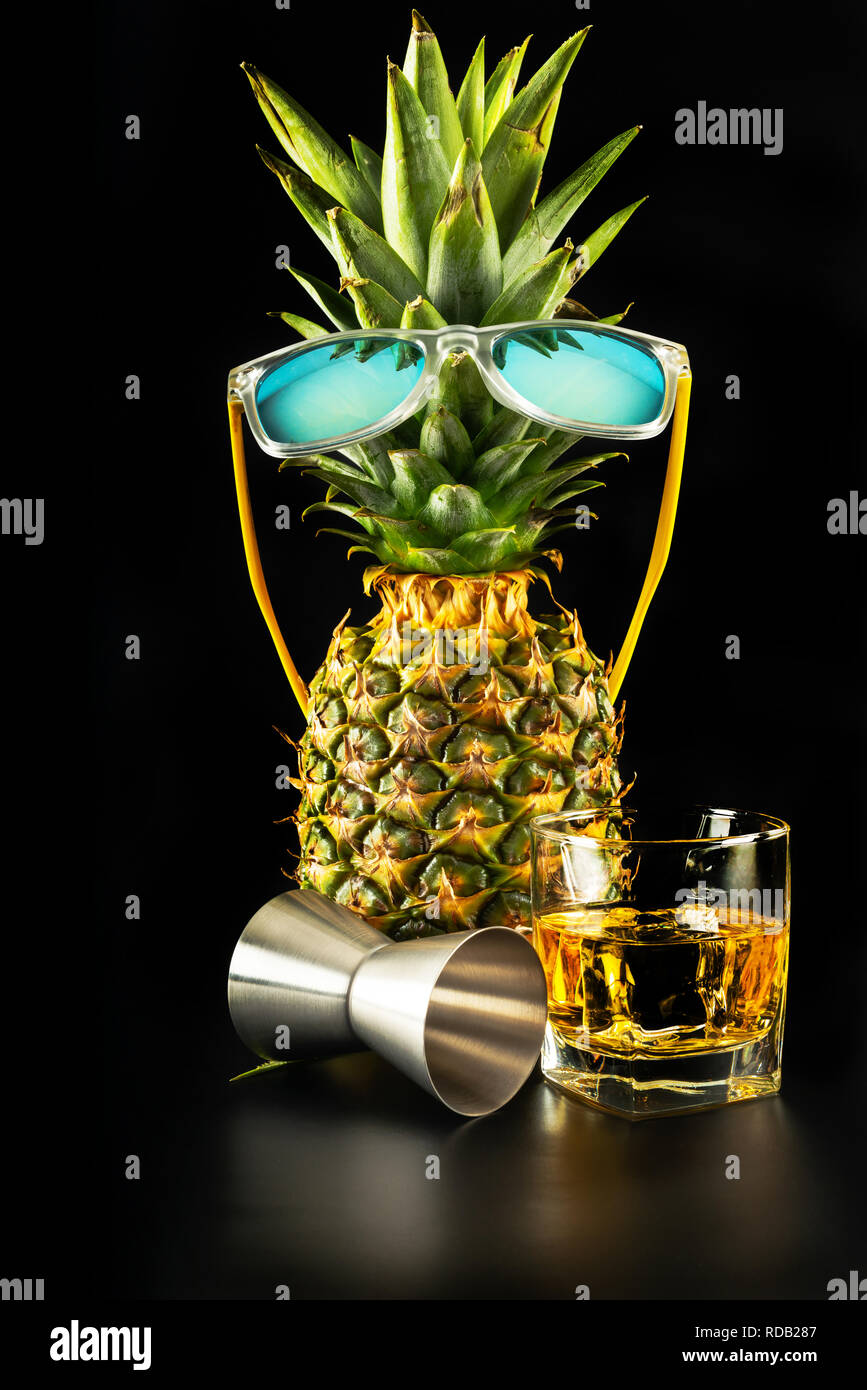 Scottish whisky in a glass with pineapple, golden color whiskey ...