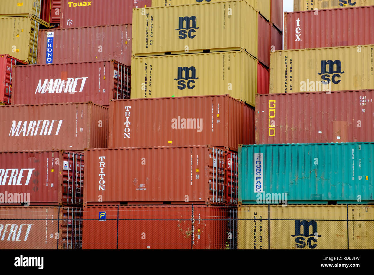 Side view of shipping containers stacked in a yard in Melbourne ...