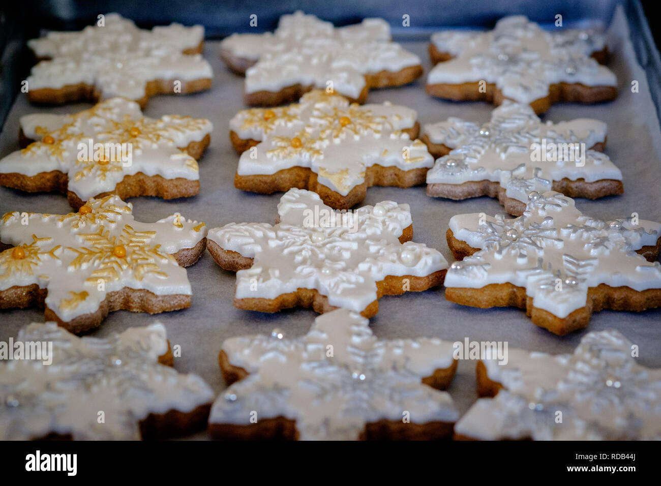 Christmas themed ginger bread snowflake biscuits with decorative ...