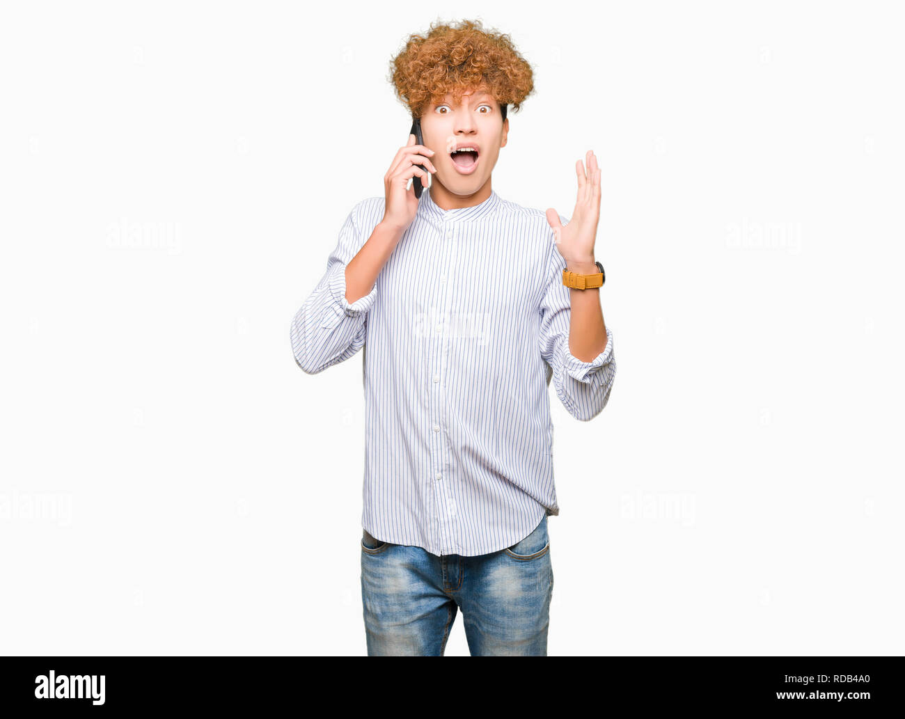 Young handsome man talking on the phone very happy and excited, winner ...