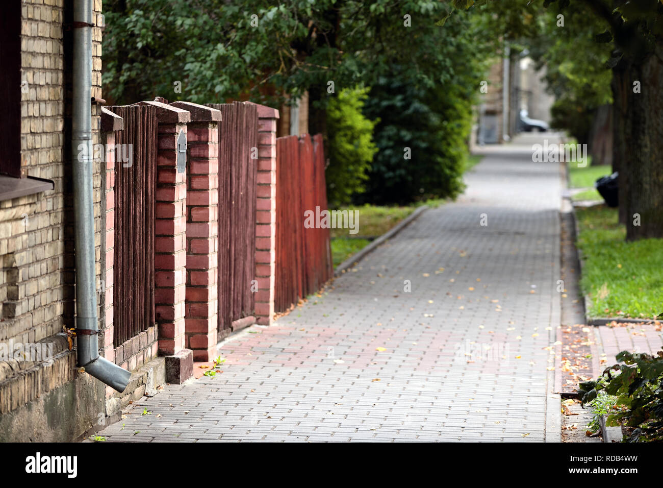 Typical European summer cityscape of old street with paving slabs ...