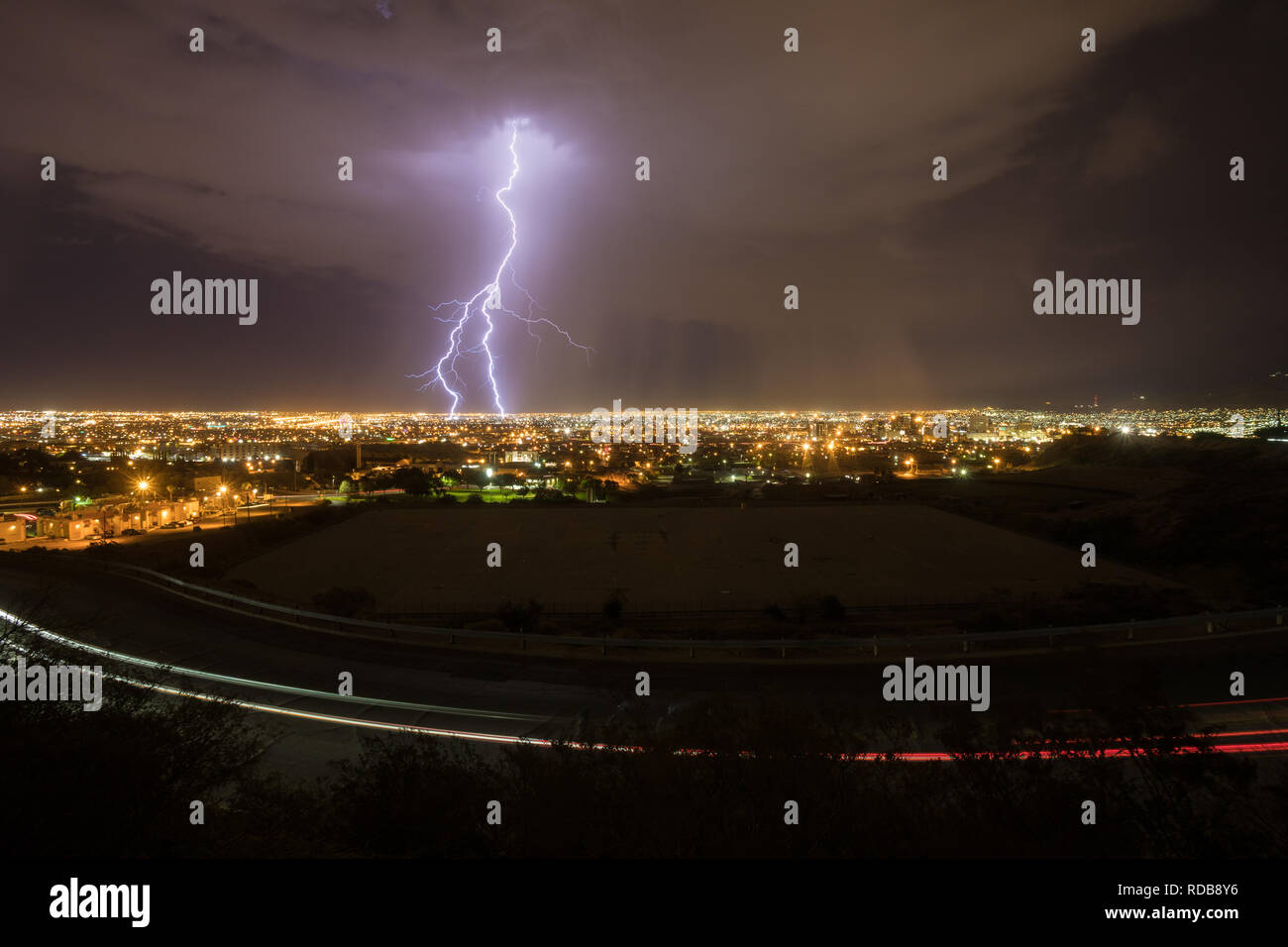 Lightning strikes central El Paso, Texas on a summer night, as traffic ...