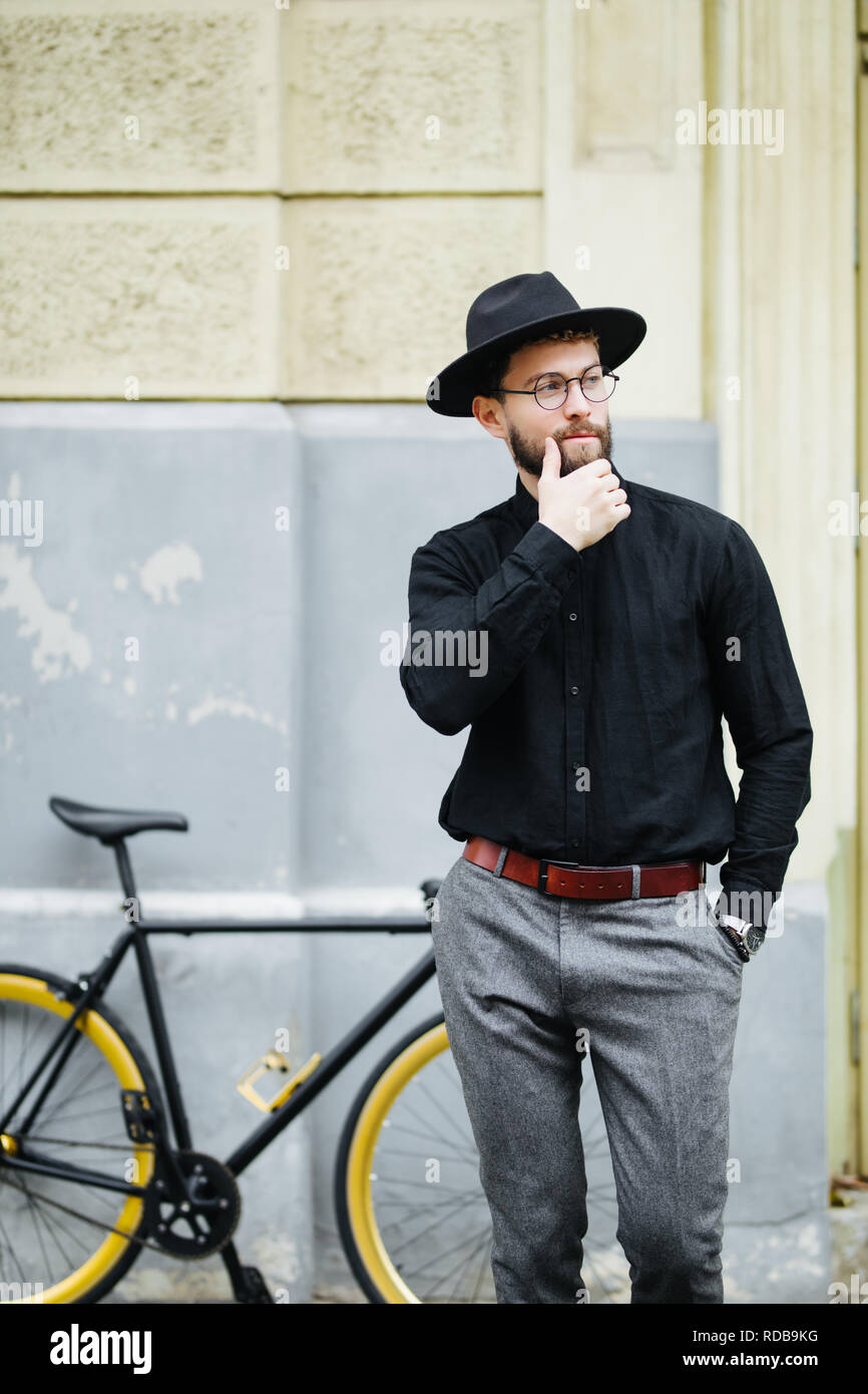 Young hipster man riding fixed gear bike on city street Stock Photo - Alamy