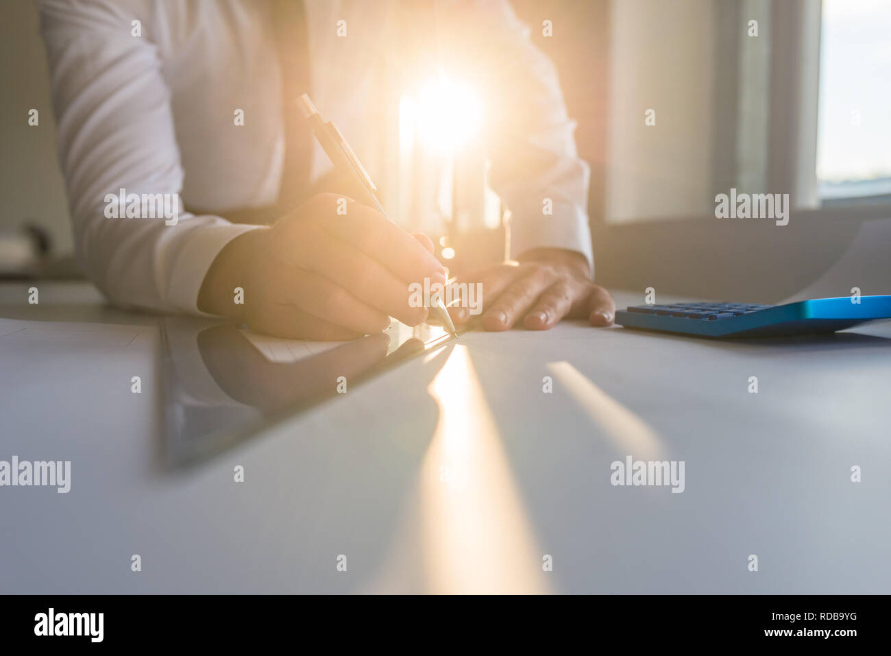 Low angle view of an architect or engineer sitting at his office desk ...