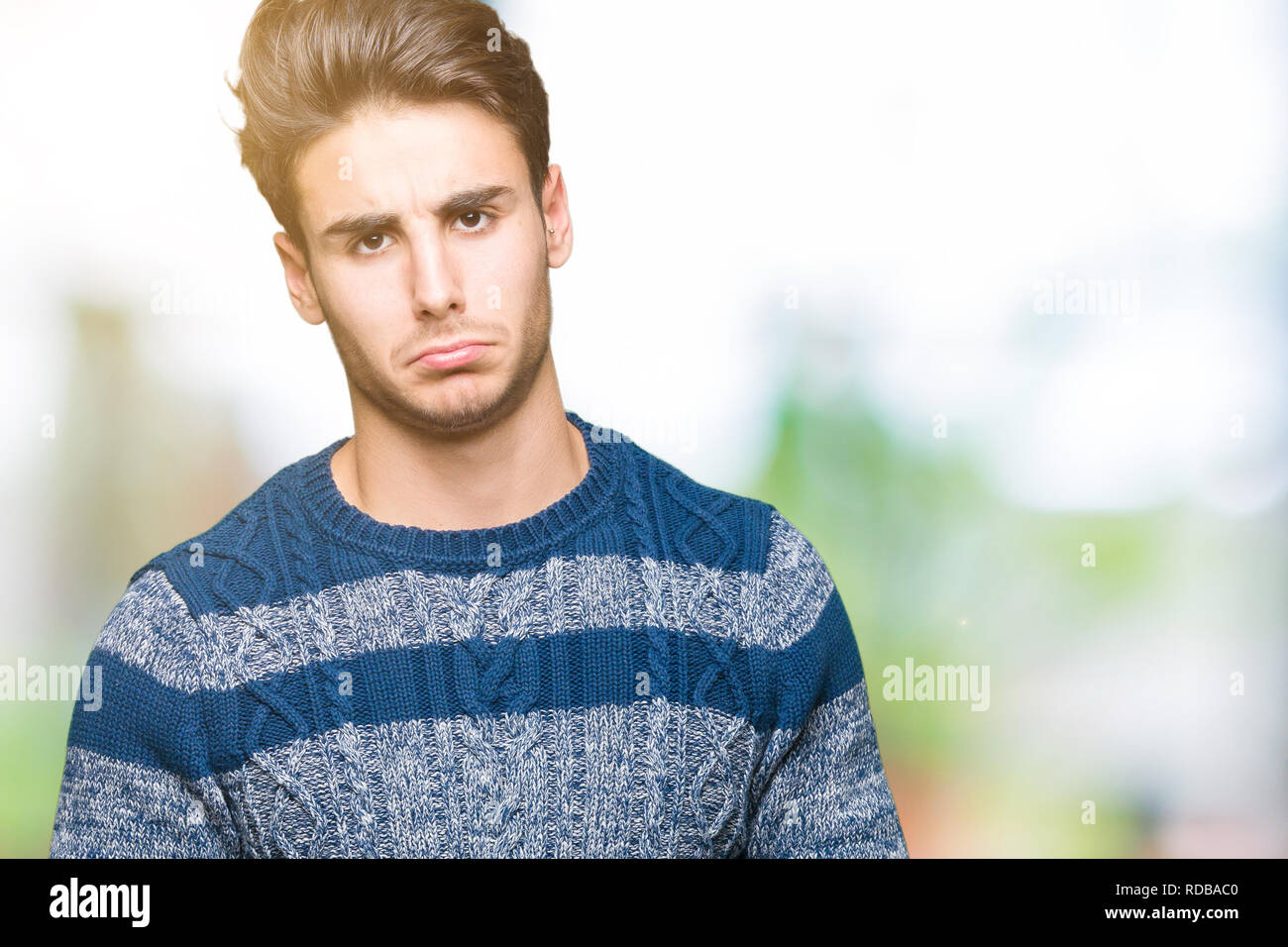 Young handsome man over isolated background depressed and worry for ...
