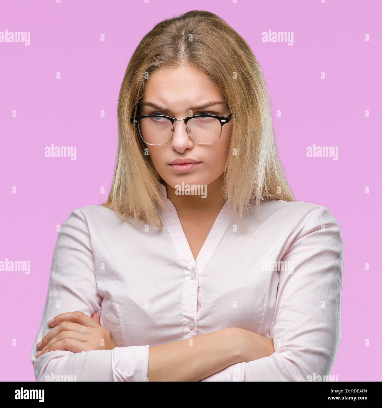 Young caucasian business woman wearing glasses over isolated background ...