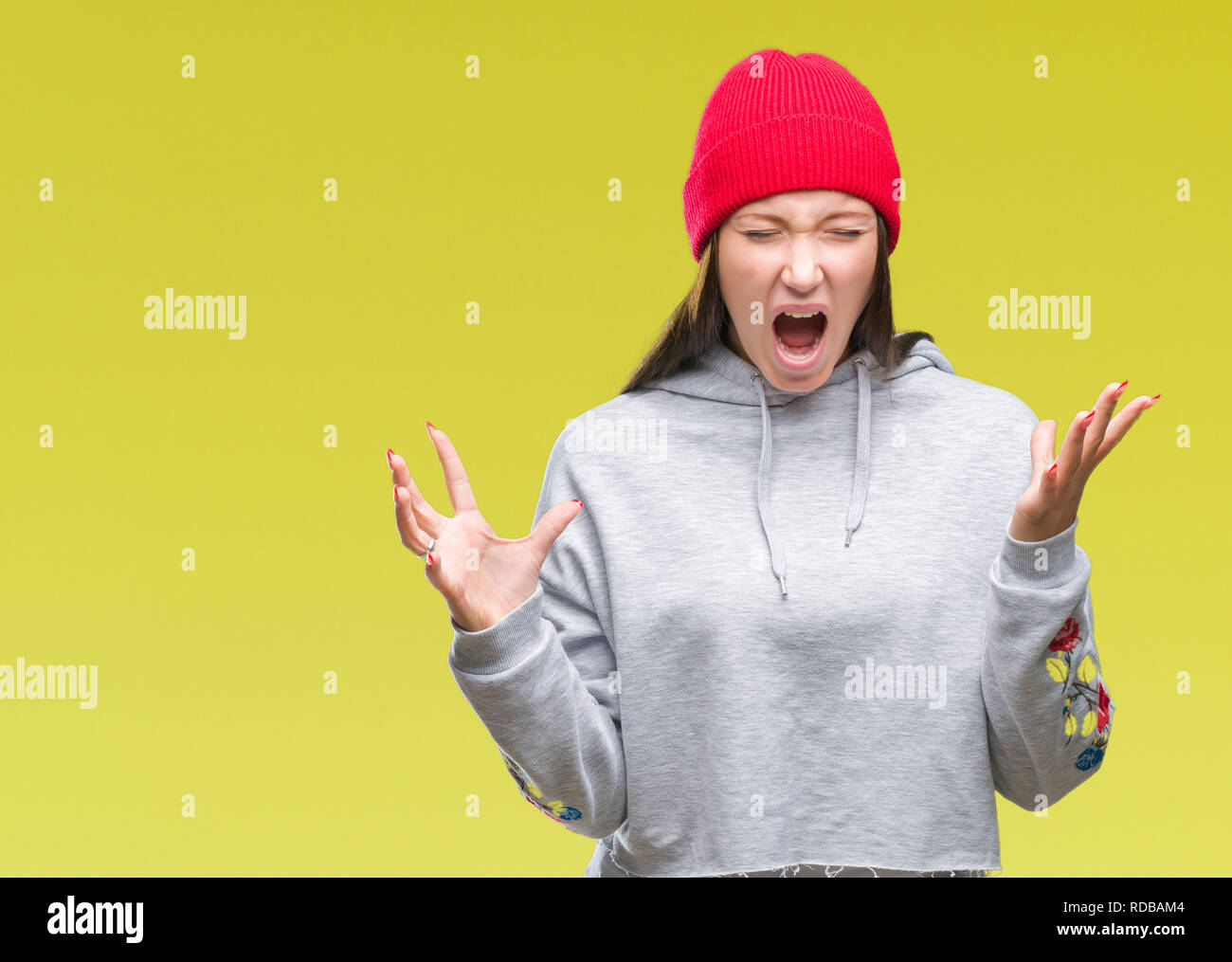Young caucasian beautiful woman wearing wool cap over isolated ...