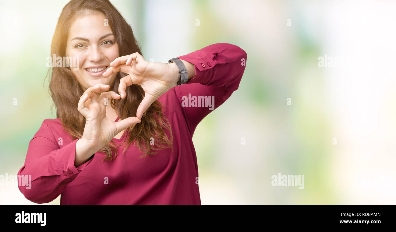 Beautiful plus size young woman over isolated background smiling in ...