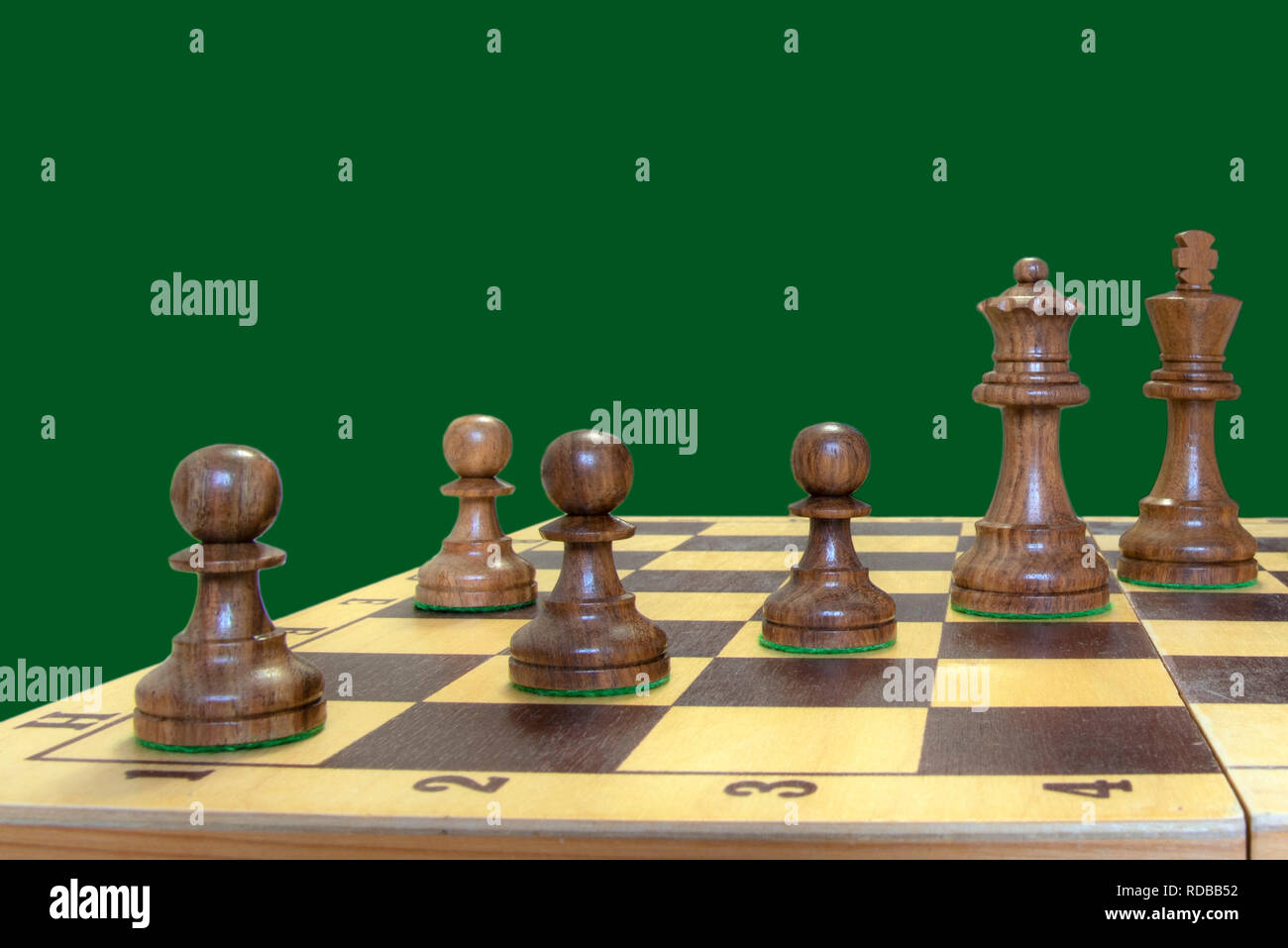 chess pieces and Board on green isolate background Stock Photo - Alamy
