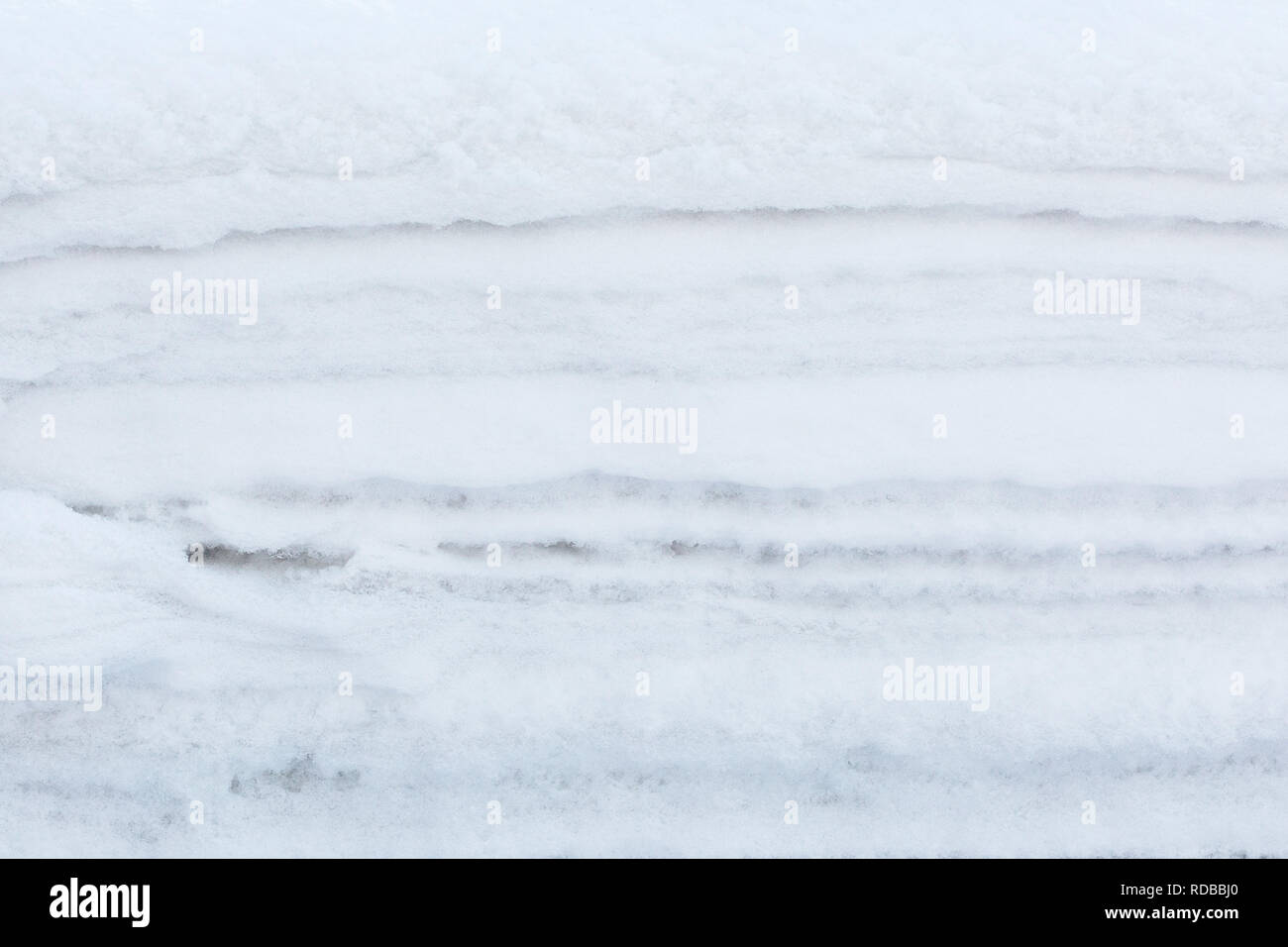 Winter white background of many snow layers texture Stock Photo - Alamy