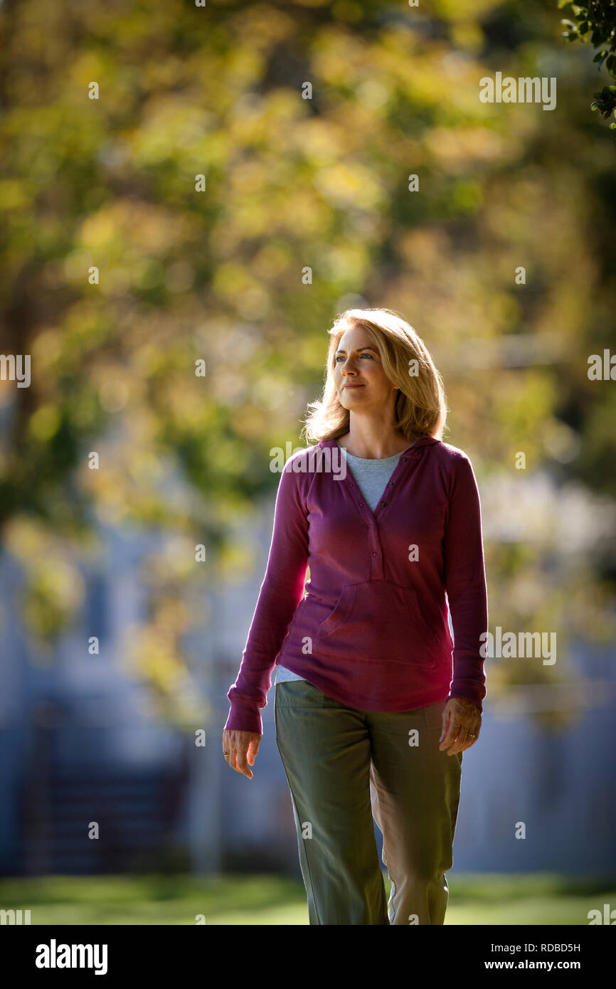 Pensive 40's woman in public hi-res stock photography and images - Alamy