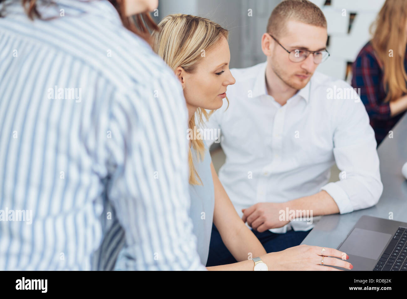 Team work around a table hi-res stock photography and images - Alamy
