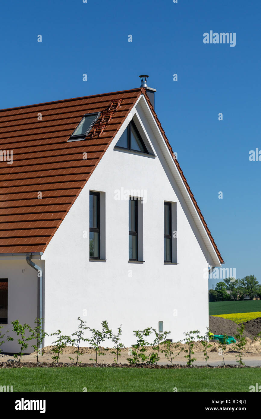 roof and facade of a white house - windows Stock Photo - Alamy