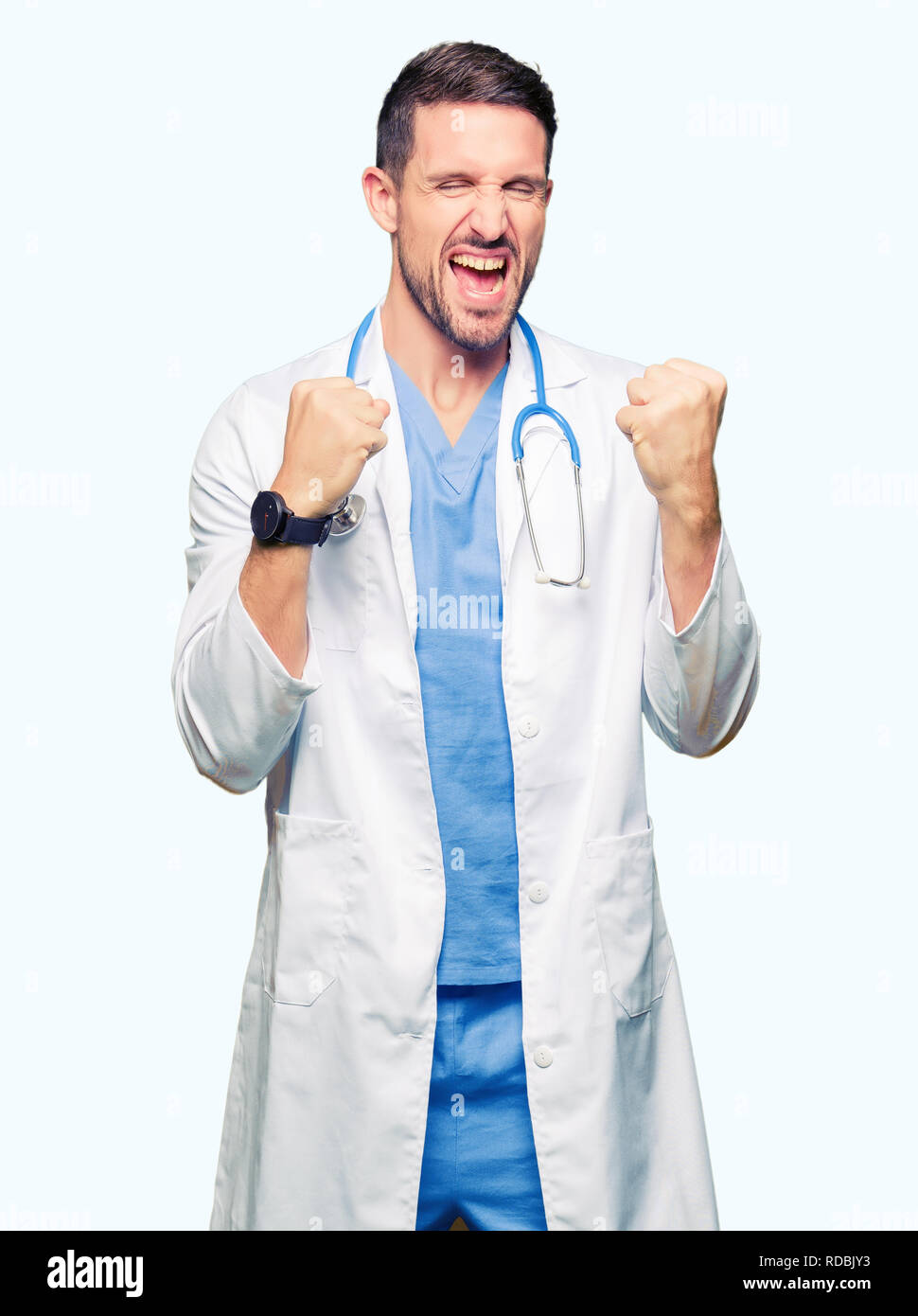 Handsome doctor man wearing medical uniform over isolated background ...