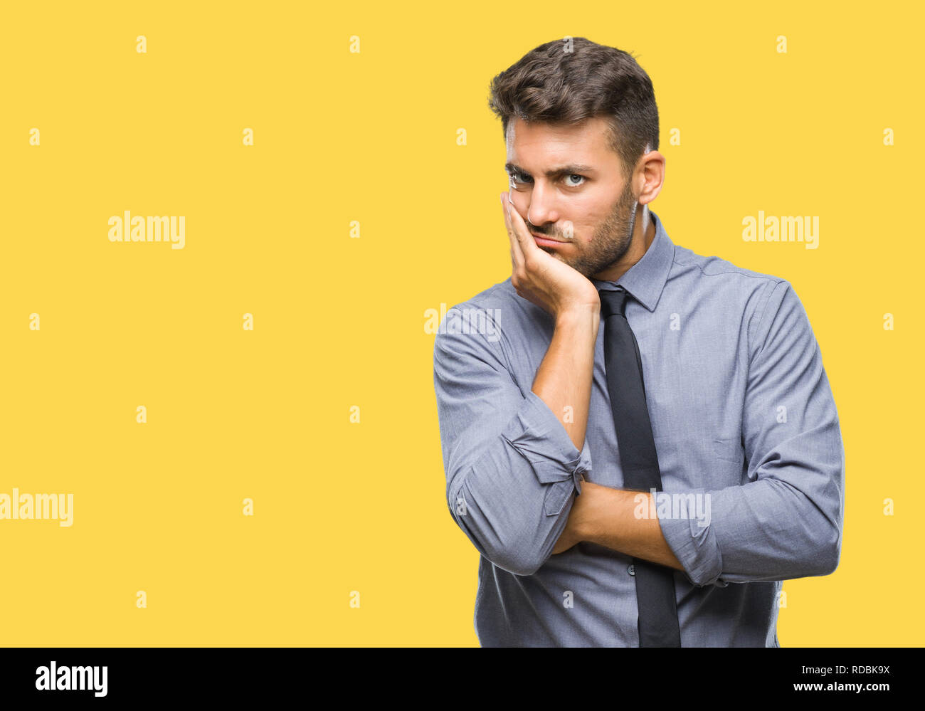 Young handsome business man over isolated background thinking looking ...