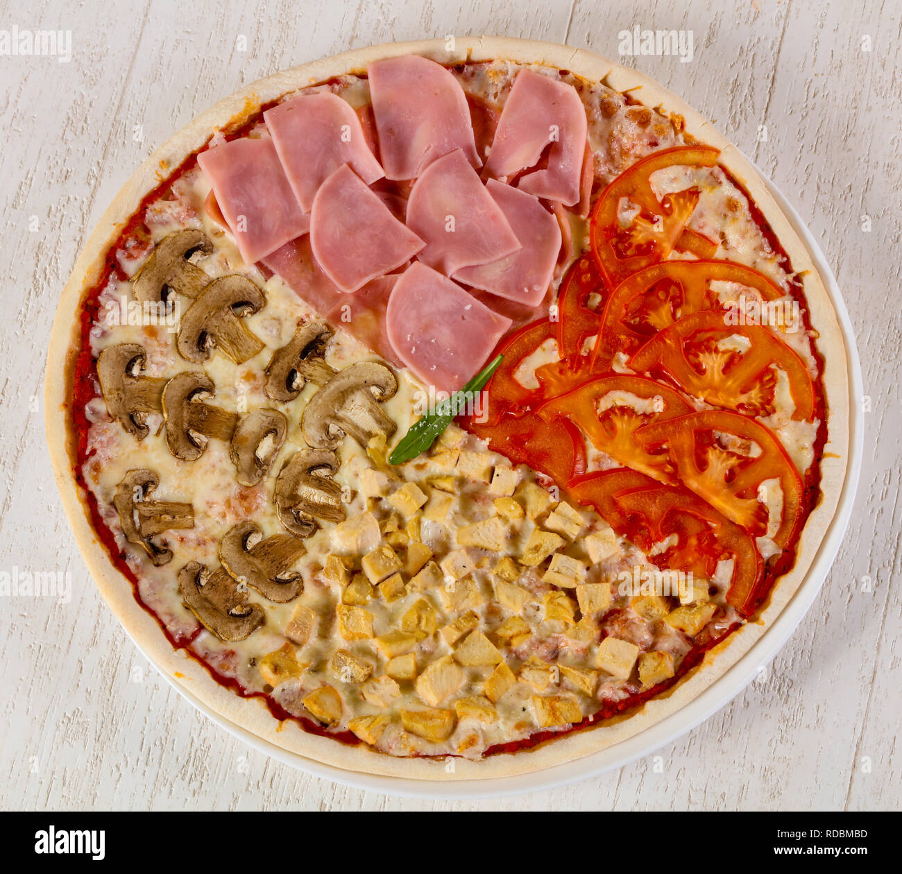 Pizza assortment mix with ham and mushrooms Stock Photo - Alamy