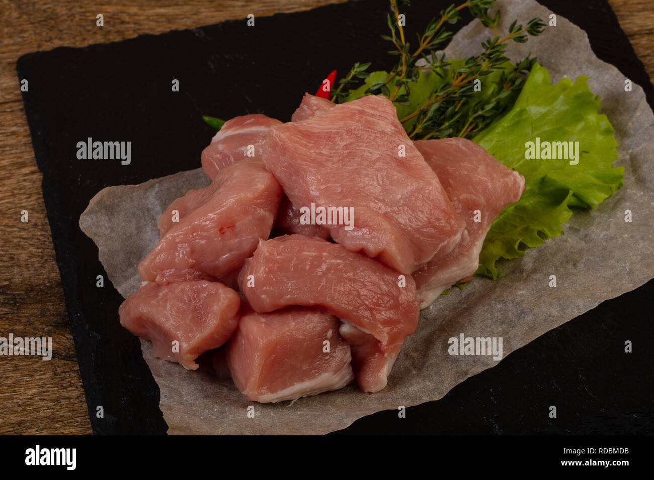 Raw pork meat heap for roast Stock Photo - Alamy