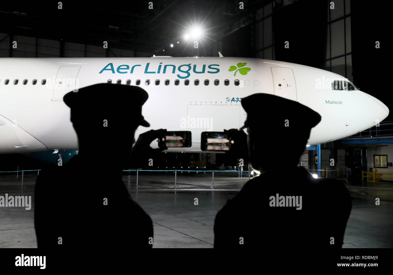 Pilots take photos of an Aer Lingus A330 displaying the new branding ...