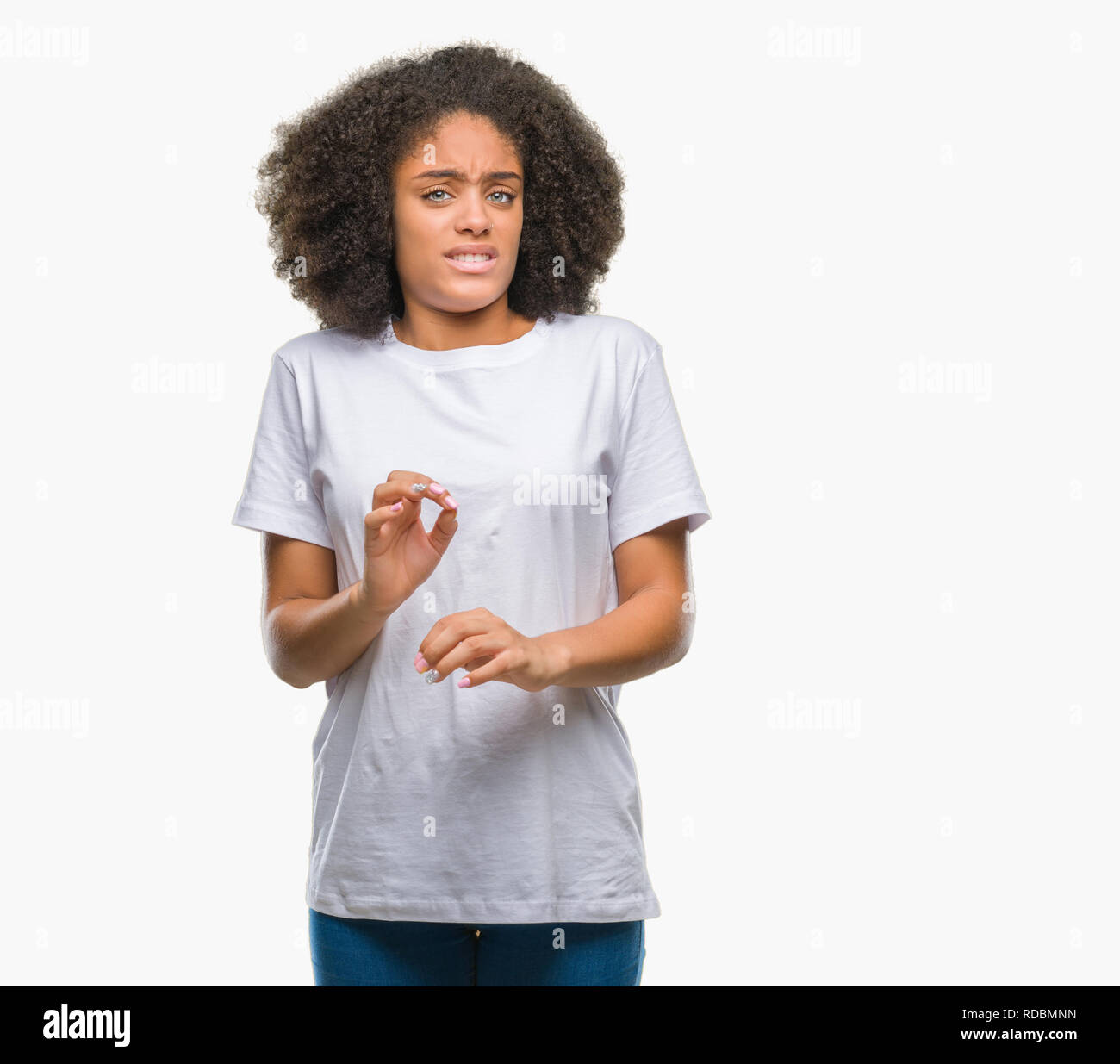 Young afro american woman over isolated background disgusted expression ...