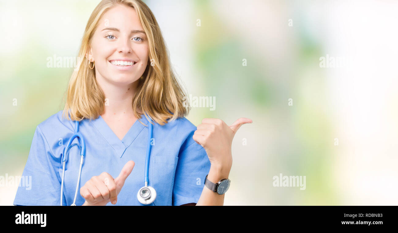 Beautiful young doctor woman wearing medical uniform over isolated ...