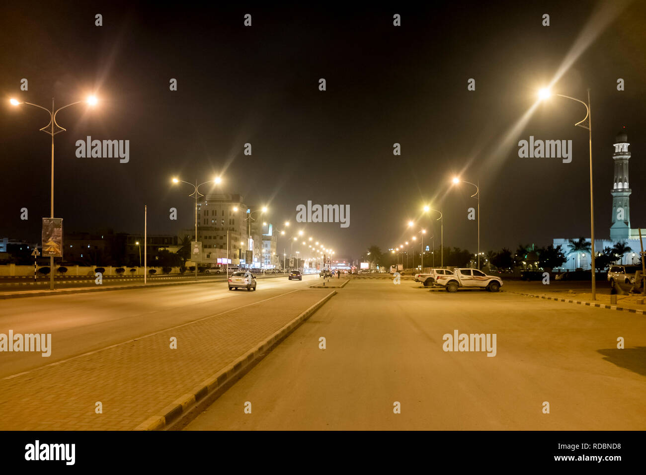 Bright streetlights in downtown Salalah, Oman, at night Stock Photo - Alamy