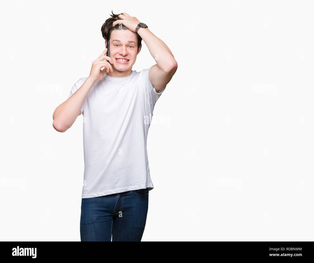 Young man talking on smartphone over isolated background stressed with ...