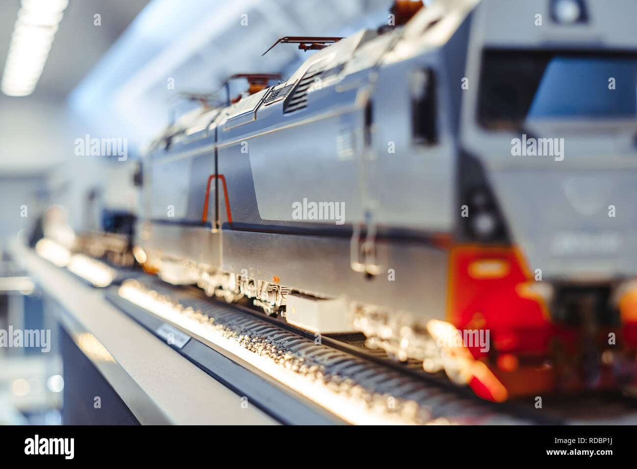 Miniature toy model of modern train crossing bridge Stock Photo - Alamy