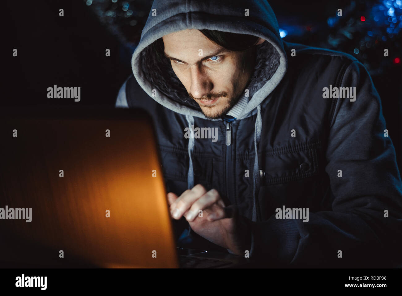the hacker behind the computer before the new year Stock Photo - Alamy