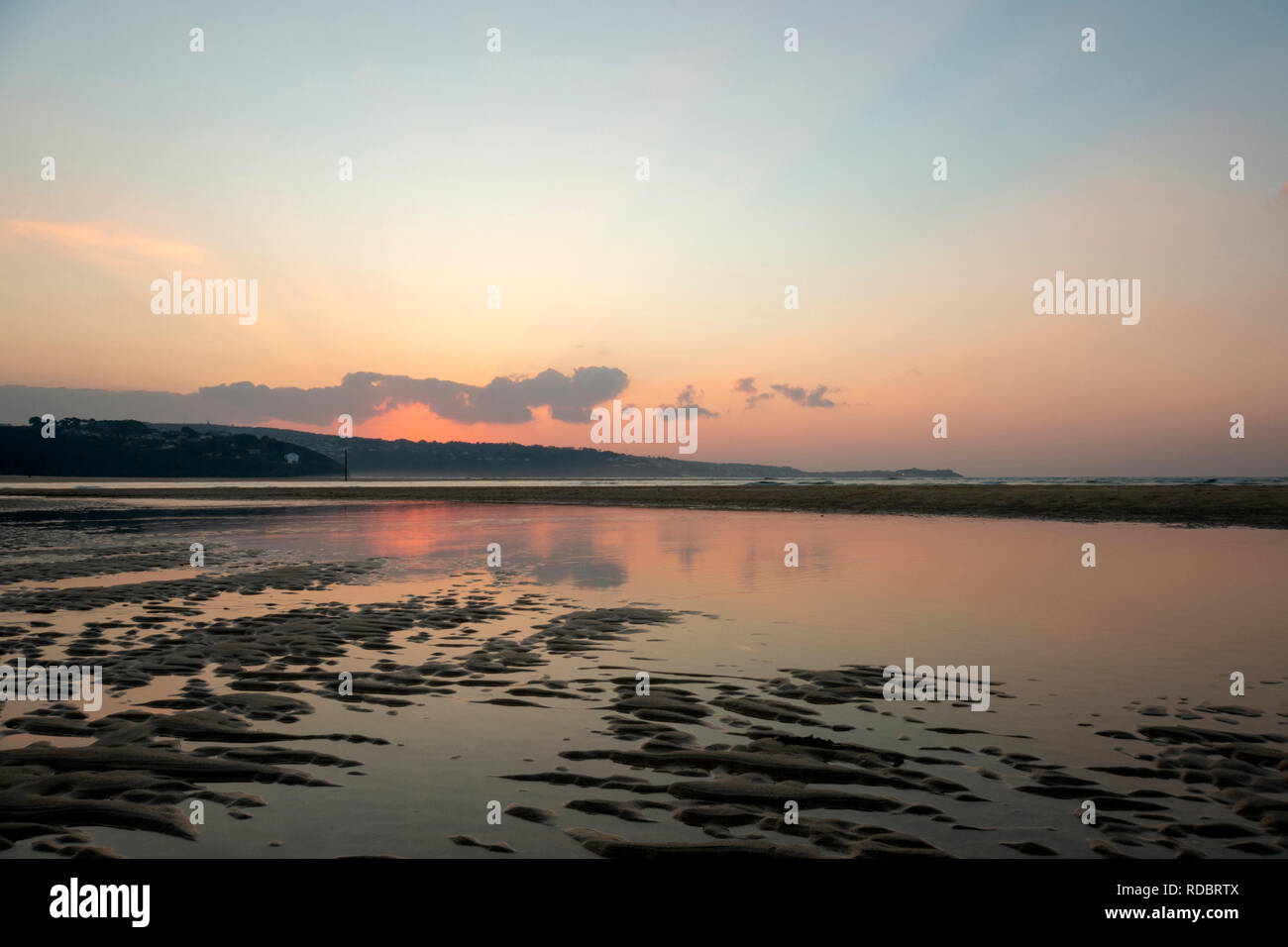 Sunset on Hayle Beach looking towards St Ives Stock Photo - Alamy