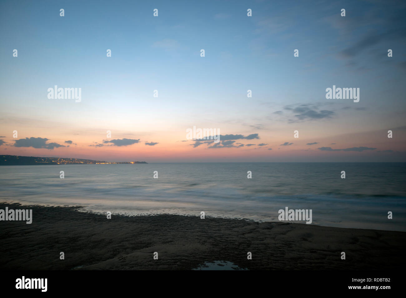 Sunset on Hayle Beach looking towards St Ives Stock Photo - Alamy