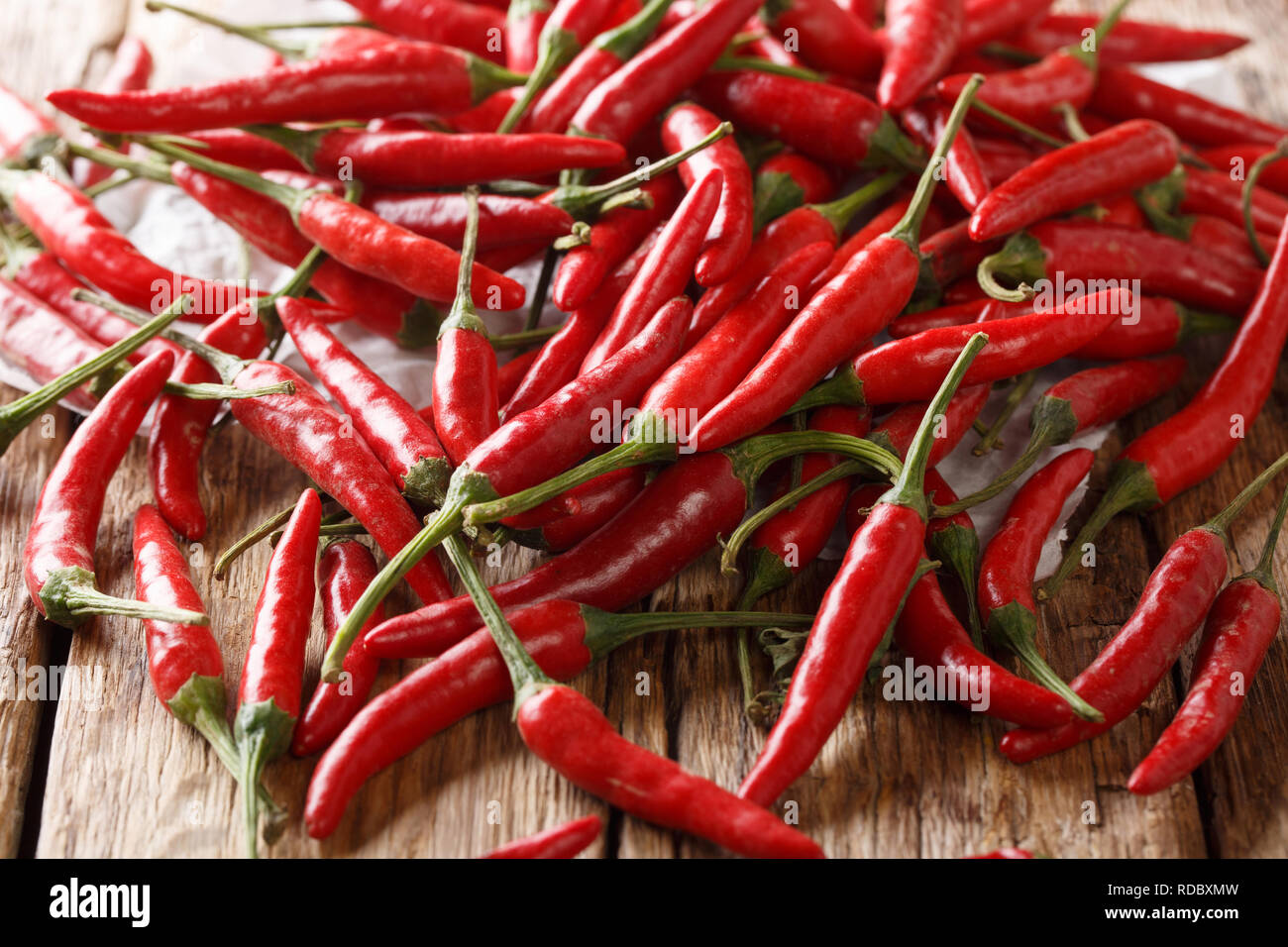African hot chili pepper piri piri close-up on wooden background ...