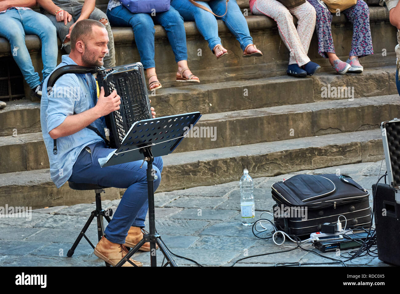 Street musicians giving a spectacular show in Piazza della Signoria in ...
