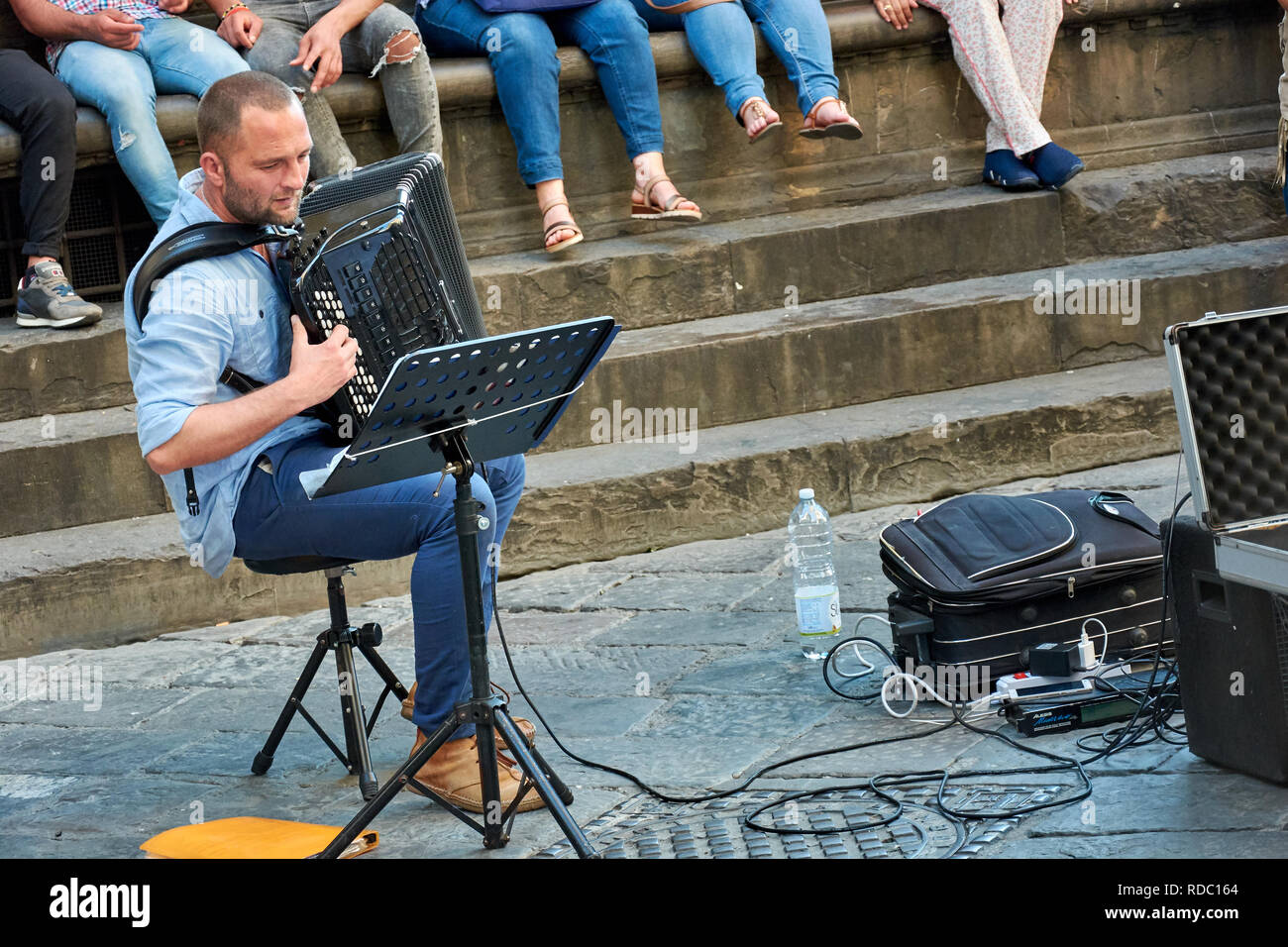 Street musicians giving a spectacular show in Piazza della Signoria in ...