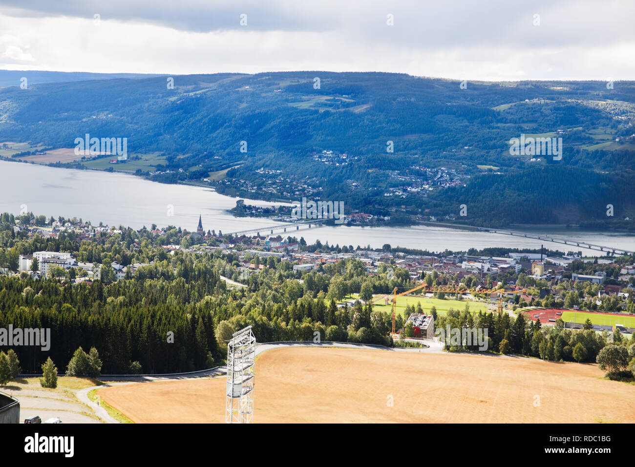 Landscape with mountains, river and buildings in Lillehammer town ...