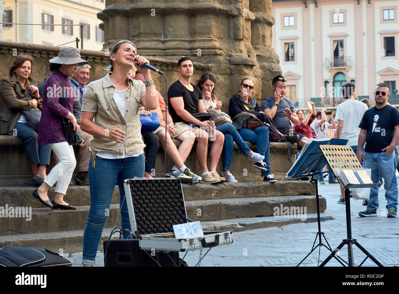 Street musicians giving a spectacular show in Piazza della Signoria in ...