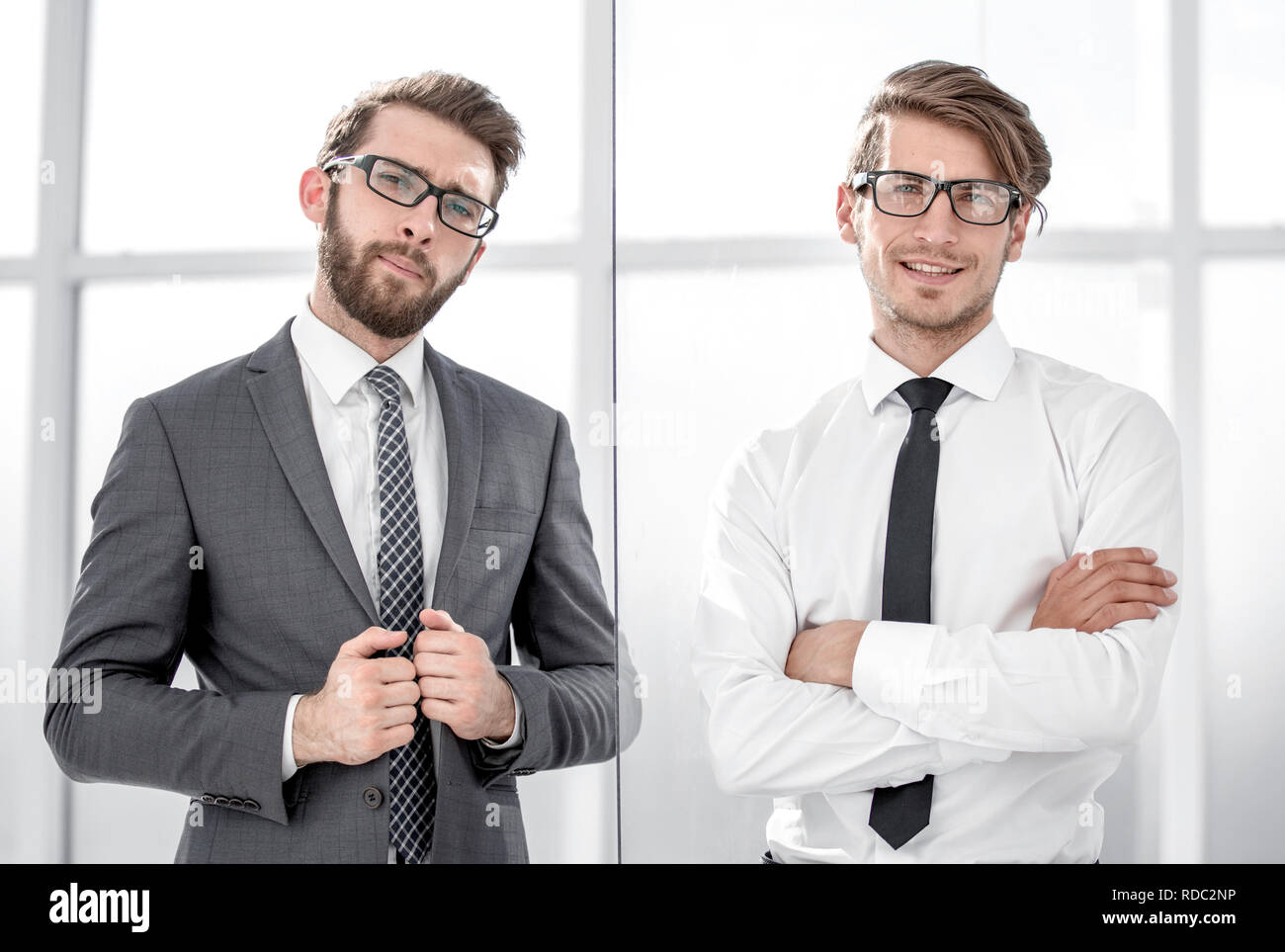 two business people standing in the office Stock Photo - Alamy