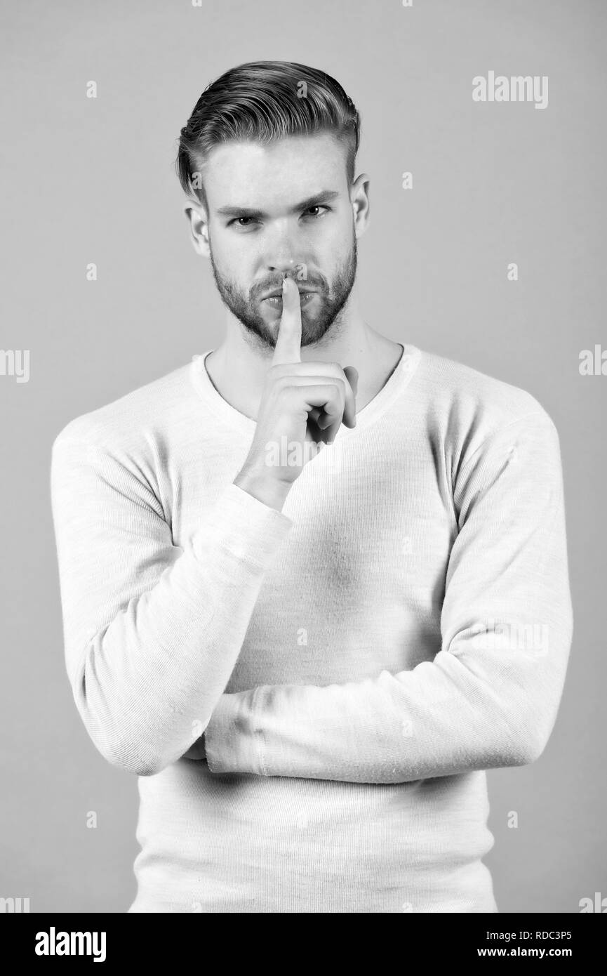 Keep silence. Man handsome attractive silence gesture. You better keep ...