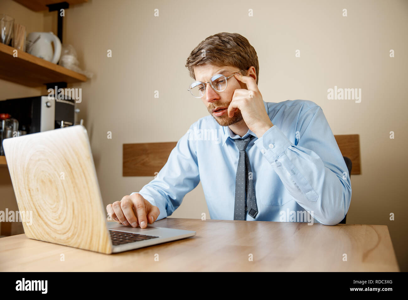 Feeling sick and tired. Frustrated sad unhappy sick young man massaging ...