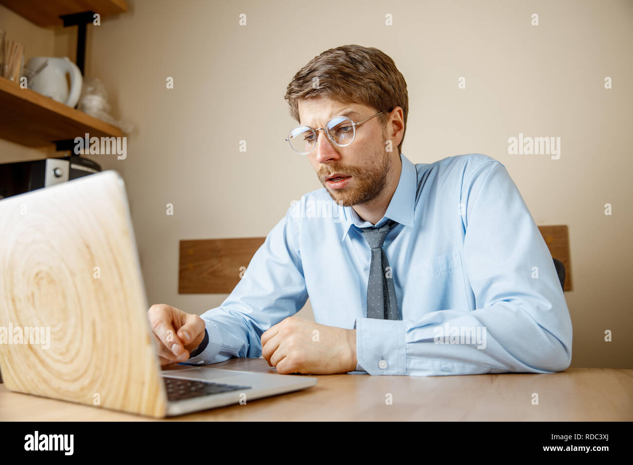 Feeling sick and tired. Frustrated sad unhappy sick young man sitting ...