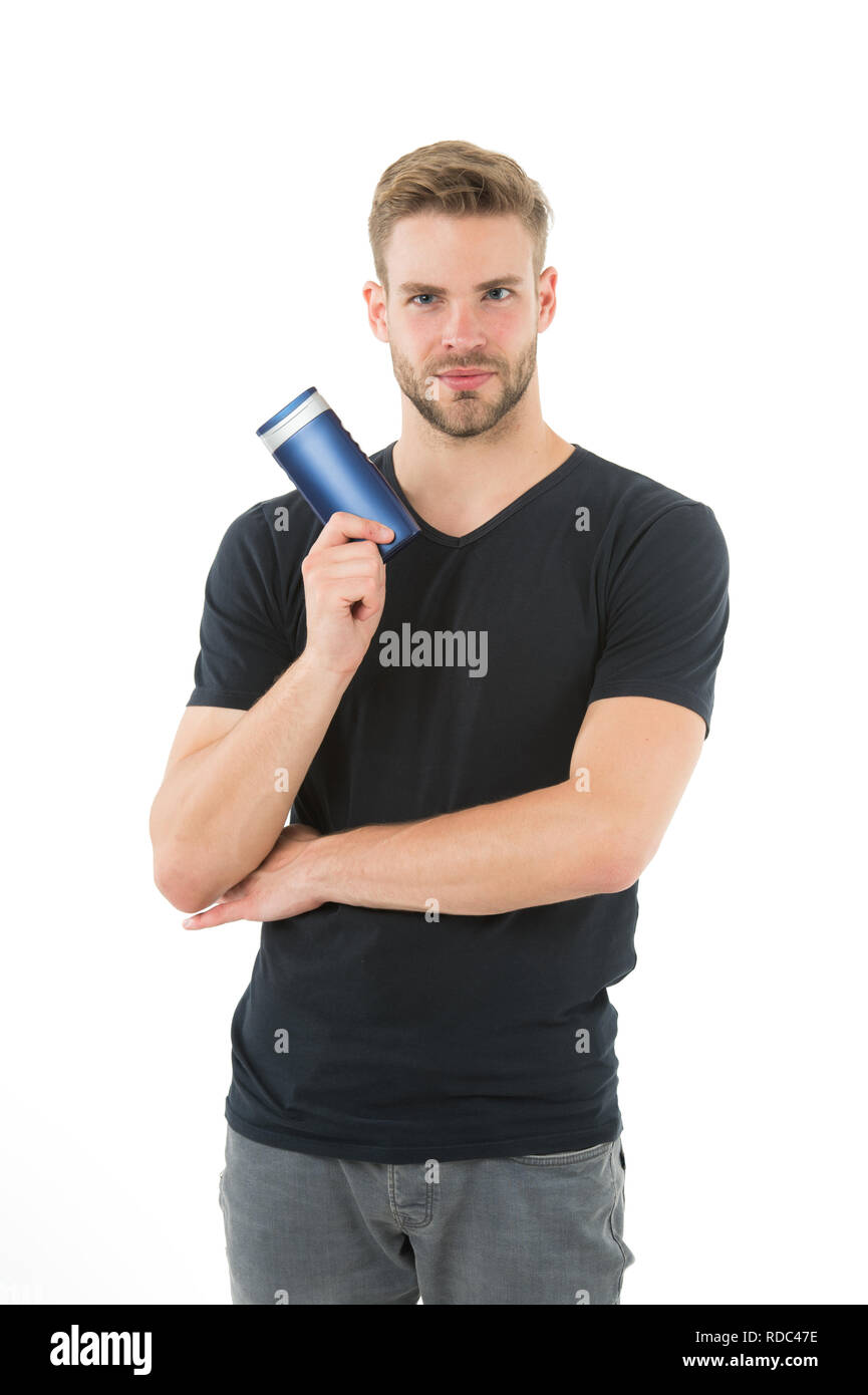Man bearded stylish hold plastic shampoo bottle. Guy handsome use ...