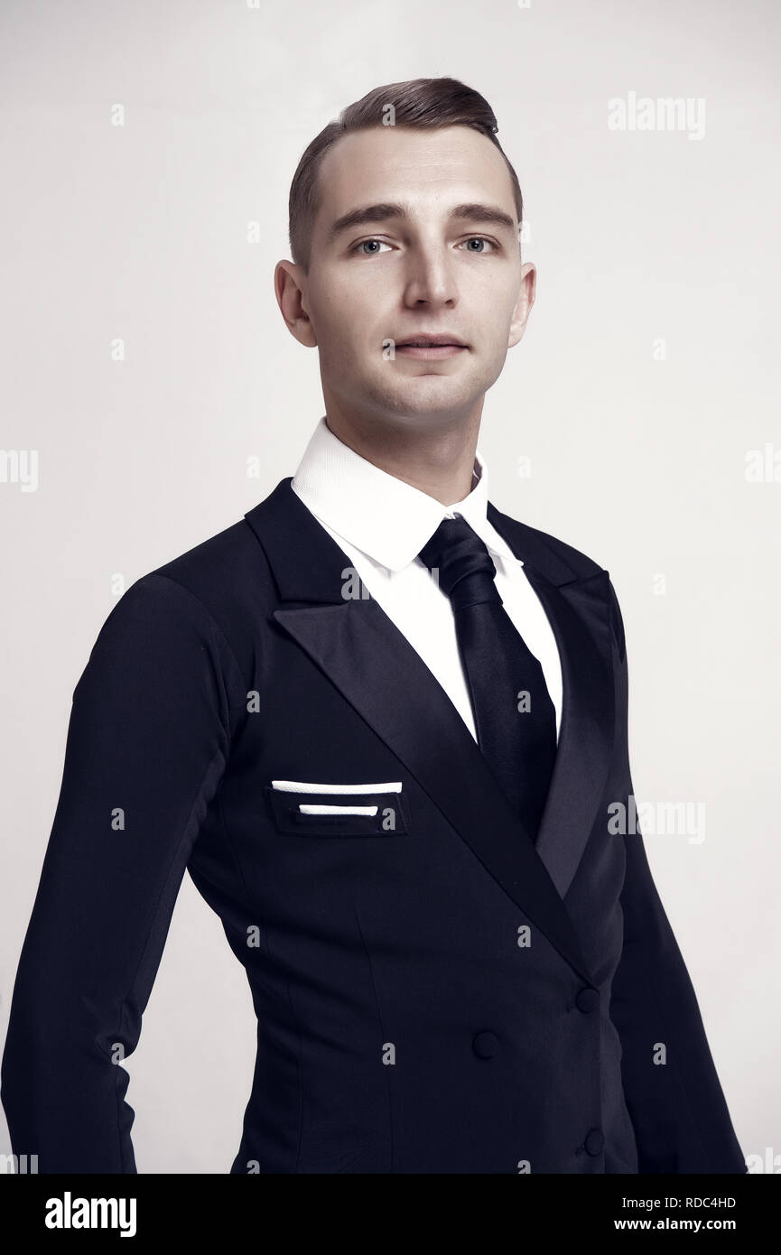 portrait of Confident attractive handsome ballroom dancer young man in ...