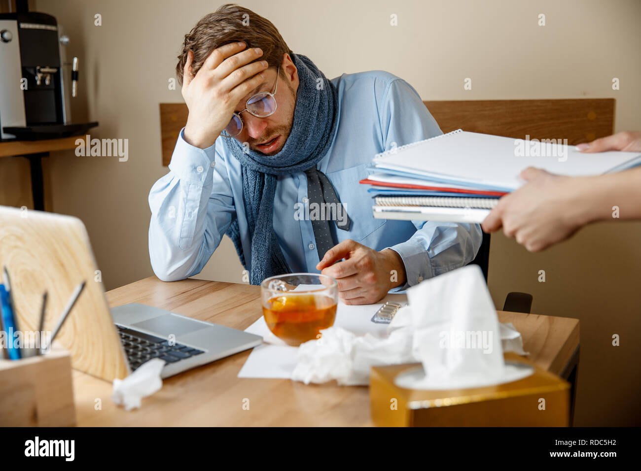 Feeling sick and tired. Frustrated sad unhappy sick young man massaging ...