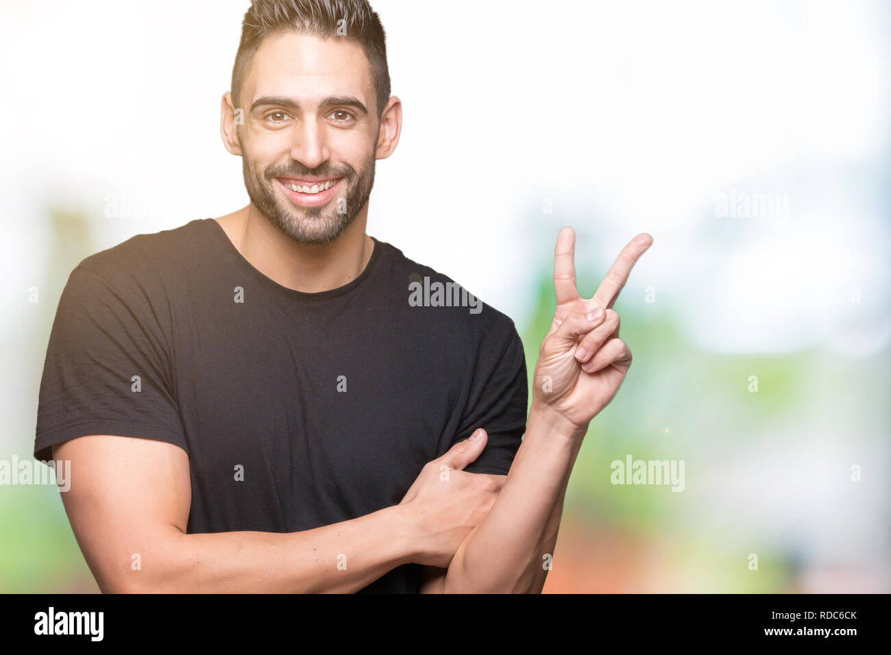 Young handsome man over isolated background smiling with happy face ...