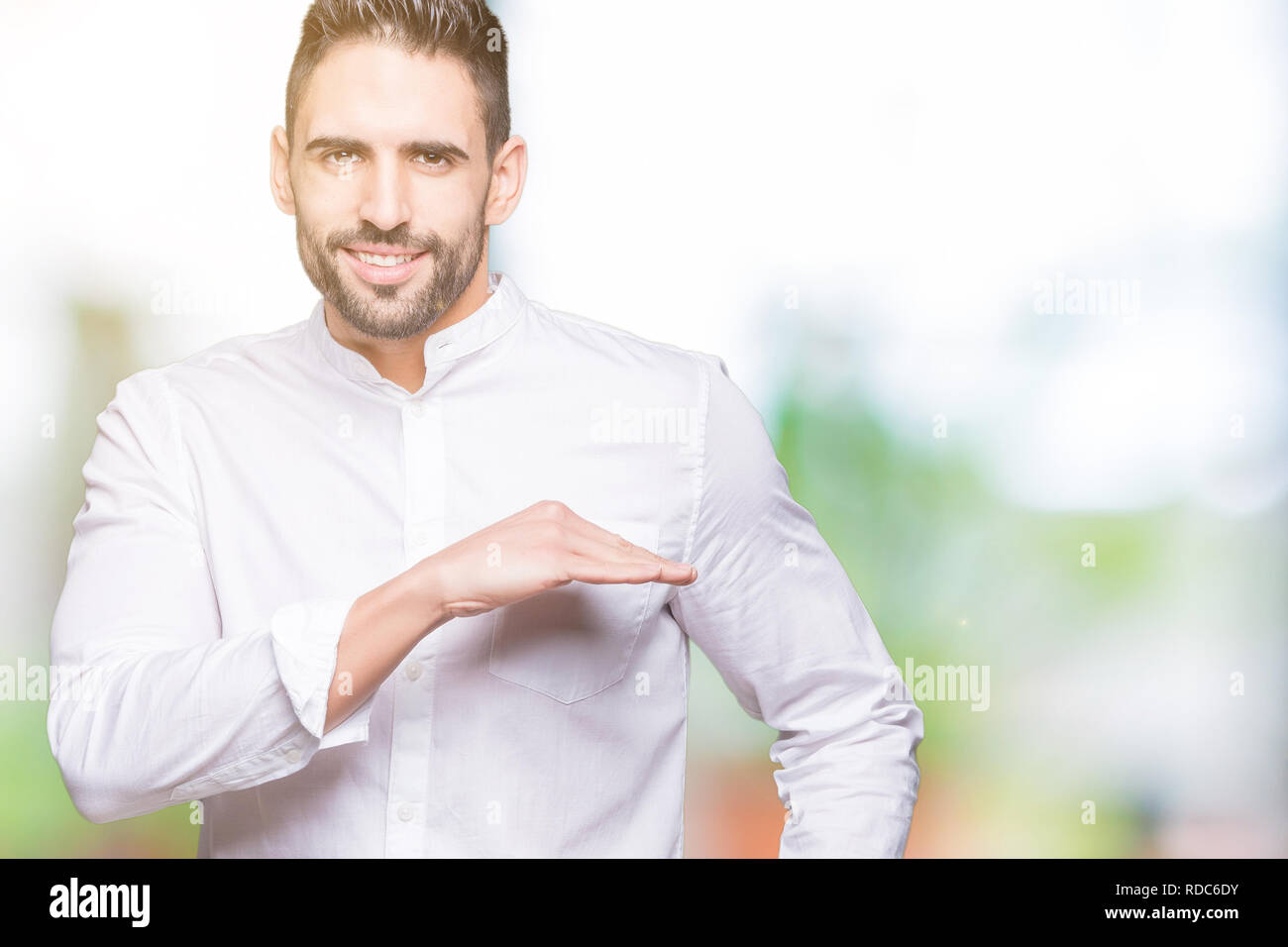 Young business man over isolated background gesturing with hands ...
